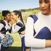 Bullying, cheerleading and friends with gossip about girl, talking ...
