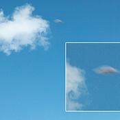 Ufo, spaceship in blue sky and alien on camera screen outdoor, surreal ...
