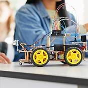 Hands, robotics classroom and students at school, learning or ...