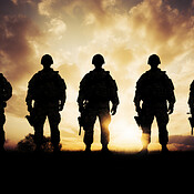 Silhouette of armed soldiers or marines in a row. Sunset. War concept ...
