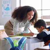 Help, teacher and woman in a classroom, children and education with ...