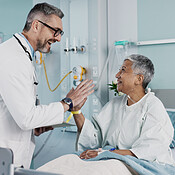 Hospital, doctor and woman high five for success with ventilation tube ...