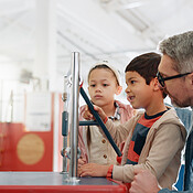 Science, teacher and students with education, classroom and chemistry ...