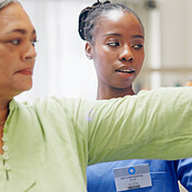 Nurse, old woman and rehabilitation with physical therapy, exercise and ...