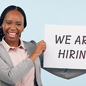 Business woman, hiring sign and studio portrait with smile for ...