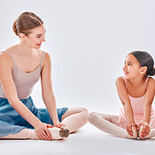 Ballet, mentor and girl stretching, training and conversation for ...