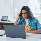 Business, laptop and woman with a headache, frustrated and consultant ...