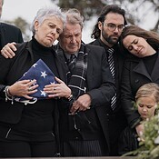 Funeral, cemetery and family with American flag for soldier for respect ...