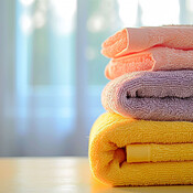 Hotel towel, laundry and clean fabric background for laundromat ...