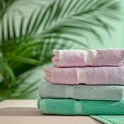 Hotel towel, laundry and clean fabric background for laundromat ...