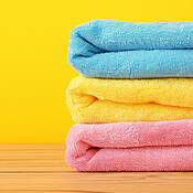 Hotel towel, laundry and clean fabric background for laundromat ...