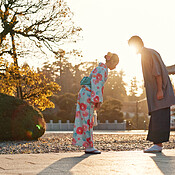 Japanese people at temple, bow and traditional clothes with hello ...