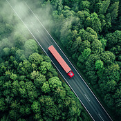 Highway, road and truck drone view of a path through the forest for ...
