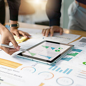 Business people, data analysis with tablet and paperwork, hands with ...