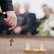 Funeral, religion and hands with rosary for memorial service, death ...