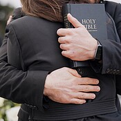 Funeral, graveyard and people hug for comfort, empathy and support at ...