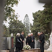 People at a funeral, death and graveyard with family mourning outdoor ...