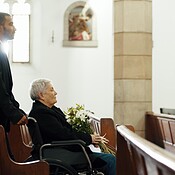 Sad, funeral and church with old woman and wheelchair user for death ...