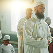 Islam, people and praying together in mosque for religion, Friday or ...