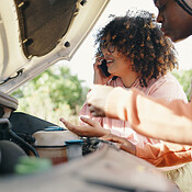 Phone call, road trip and vehicle breakdown with friends on road ...