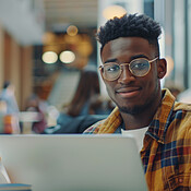 University, portrait and black man with books for studying in library ...