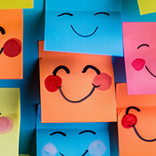 Paper, art or sticky note smile sketch on wall for creative, design or ...