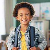 Smile, face and student in classroom for education, learning and ready ...