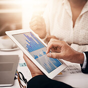 Taking a detailed look at their business stats | Buy Stock Photo on ...