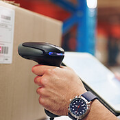 Logistics, hands and man scanning barcode in warehouse with tablet for ...