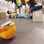 Accident, fall and helmet with man in warehouse for delivery ...