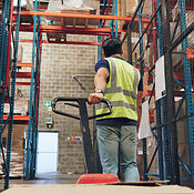 Pallet truck, man and box in warehouse with transport, safety and ...