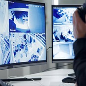 Security guard, walkie talkie and speaking by cctv monitor for ...