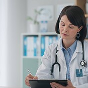 Report, woman and writing in office, doctor and medical diagnosis in ...