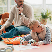 Children, parents and drawing for education on floor with family ...