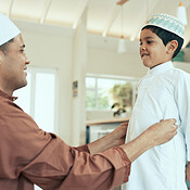Muslim family, man and son dressing in home, happy and prayer ...