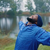 Black man, enjoy and rain for travel outdoor on camping adventure ...