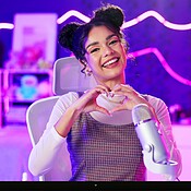 Streamer, portrait and woman with microphone, heart hands and neon ...