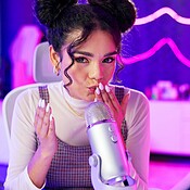 Woman, microphone and influencer with social media streaming and ASMR ...