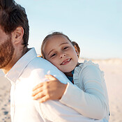 Father carrying his little girl. Happy father giving his daughter a ride. Young parent bonding ...