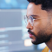 Serious, man and coding with computer for cybersecurity, developer update and app upgrade ...