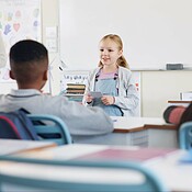 Classroom, happy kid and reading presentation for learning, education ...
