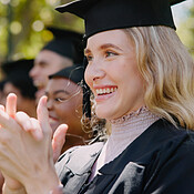 Education, woman and students clapping hands at graduation for academic ...