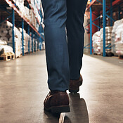 Shoes, legs and man in warehouse, walking and logistics with inventory ...