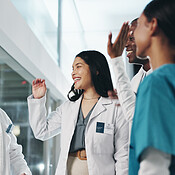 Healthcare, team and celebration in hospital for success, medical ...