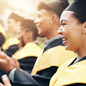 Outside, students and applause for university graduation on campus for ...