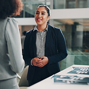 Welcome booth, conference and business people at expo for summit ...