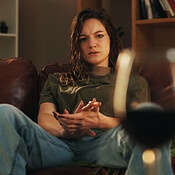 Alcoholic, thinking and wine with woman in living room for substance ...