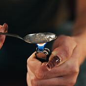 Spoon, hands and woman with drugs in home for illegal narcotics ...