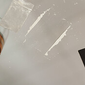 Drugs, cocaine and alcohol on glass table in apartment with opioid ...