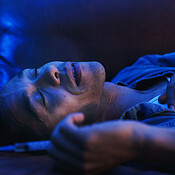 Drugs, overdose and man on sofa with syringe, health risk and narcotic ...